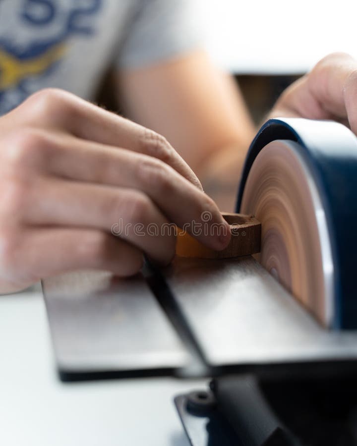 Vertical Shot of Hand Filing Wood Ring on a Grinding Machine Stock ...