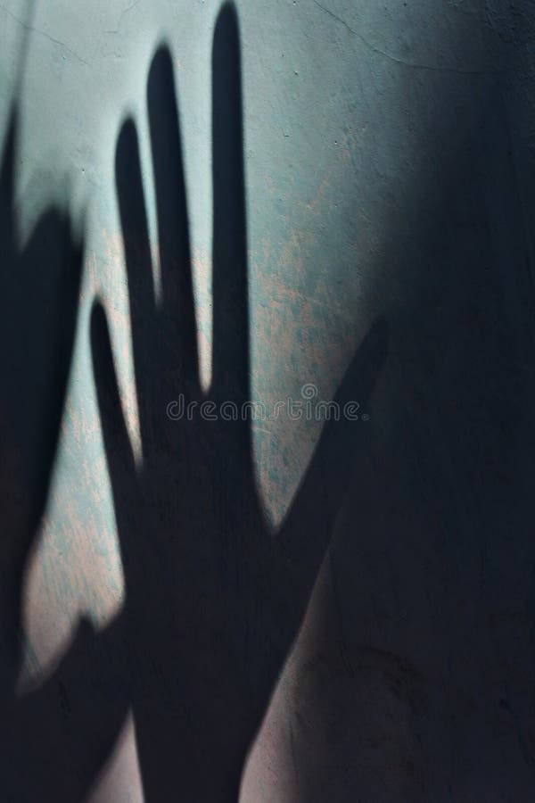 Vertical Shot of a Hand Shadow on the Wall Stock Photo - Image of ...