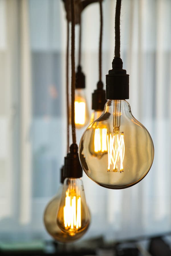 Vertical Shot of Hanging Vintage Light Bulbs Stock Image - Image of ...