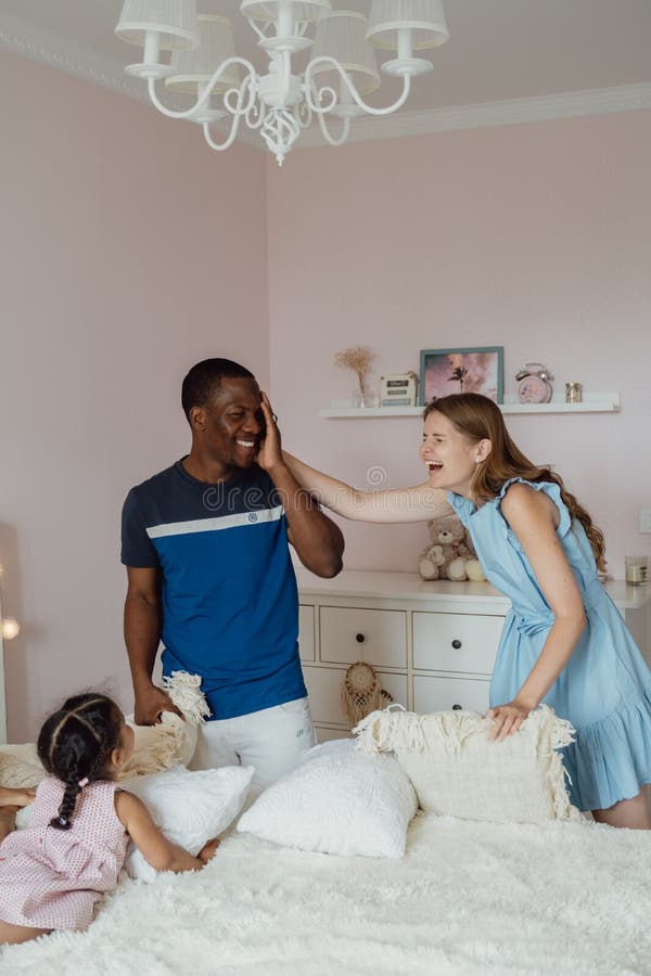 Vertical Shot of a Happy Family Stock Photo - Image of bedroom, love ...