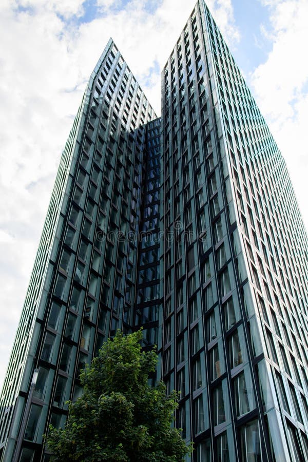 Vertical Shot of a High-rise Building with Mirror Windows Under the ...