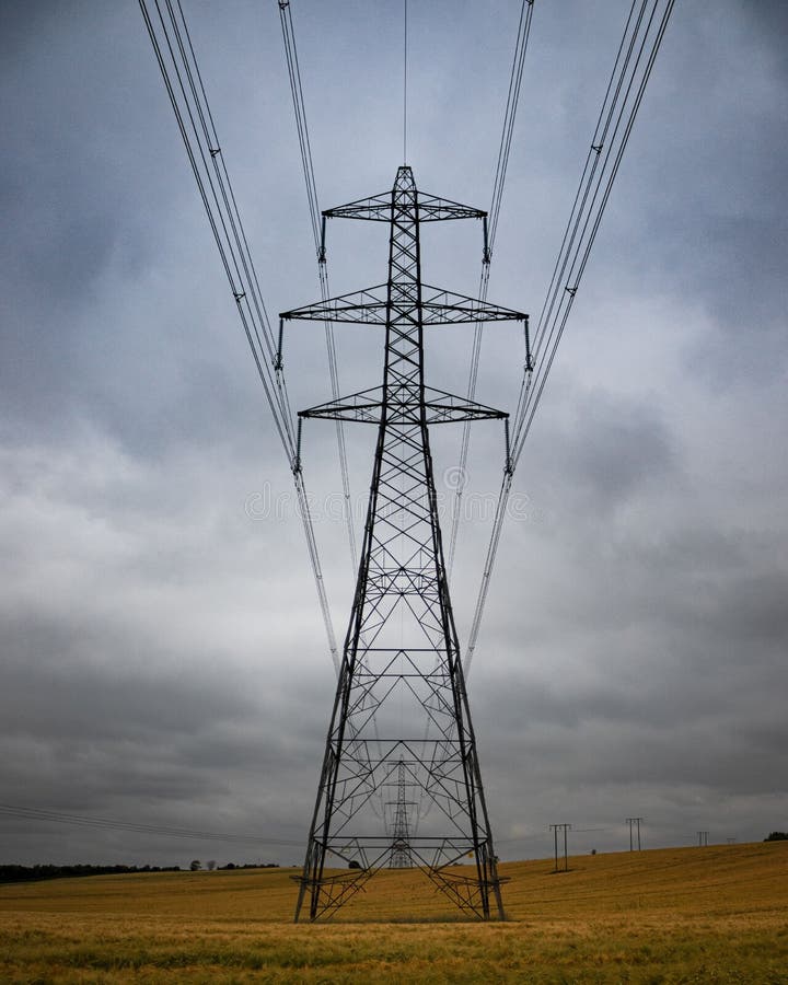 Vertical Shot of a High Voltage Electrical Tower on in a Field on a ...