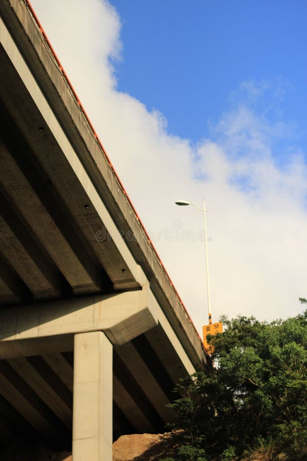 Vertical Shot of a Highway Bridge with a Street Light from Below ...