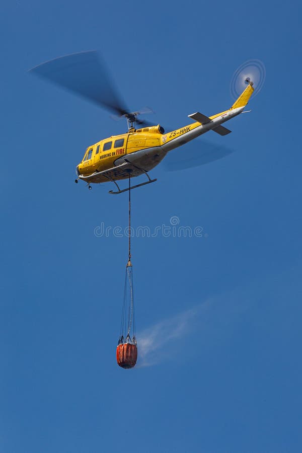 Vertical Shot of a Huey Helicopter Dropping a Water Bag Editorial Photo ...