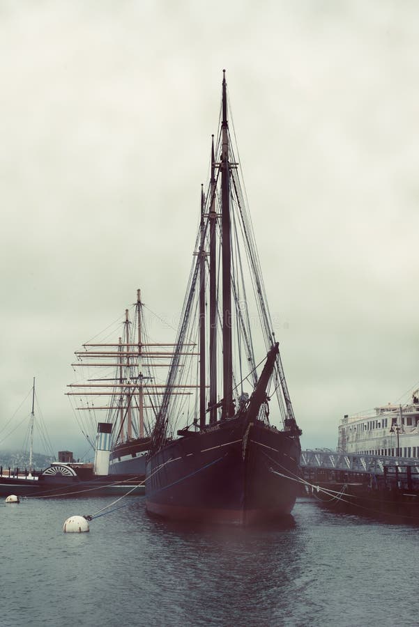 Vertical Shot of a Huge Old Ship in a Dock Captured on a Cloudy Day ...
