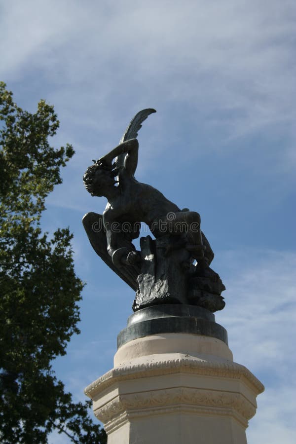 Vertical Shot of a Human Statue with Wings Outdoors Stock Image - Image ...