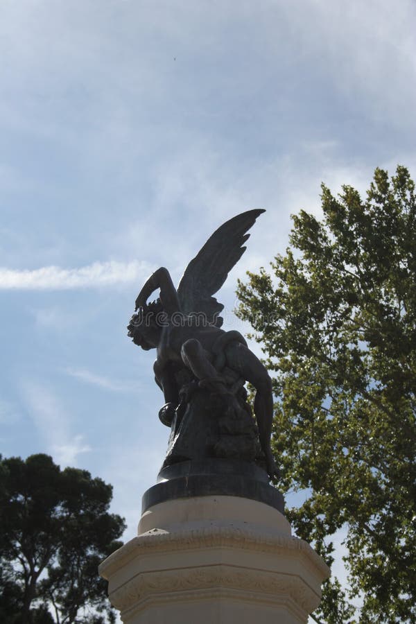 Vertical Shot of a Human Statue with Wings Outdoors Stock Image - Image ...