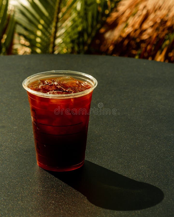 Vertical Shot of an Iced Drink in a Plastic Cup on a Table Stock Photo ...