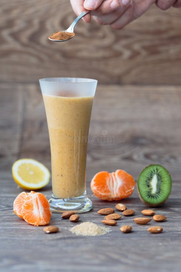 Vertical Shot of an Iced Shake and Fresh Fruits on a Wooden Surface ...