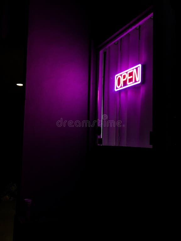 Vertical Shot of an Illuminated Purple Open Sign Stock Photo - Image of ...