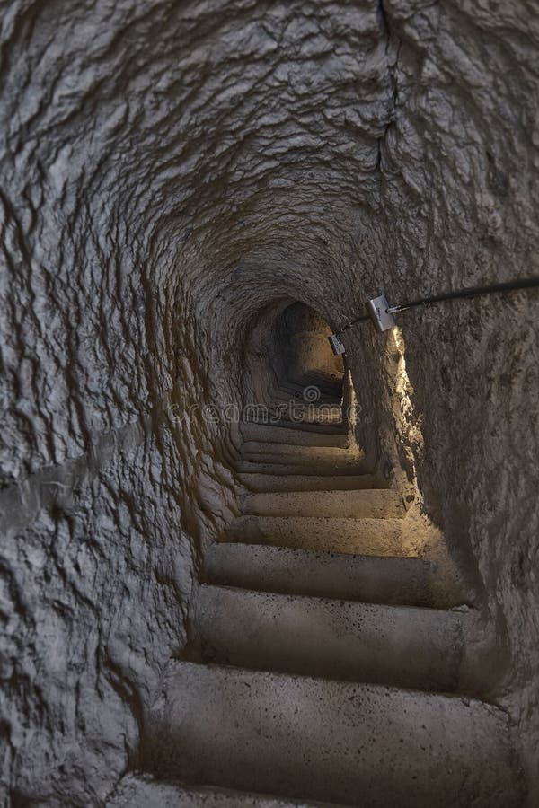 Vertical Shot of the Inside of a Cave with Stairs Stock Image - Image ...