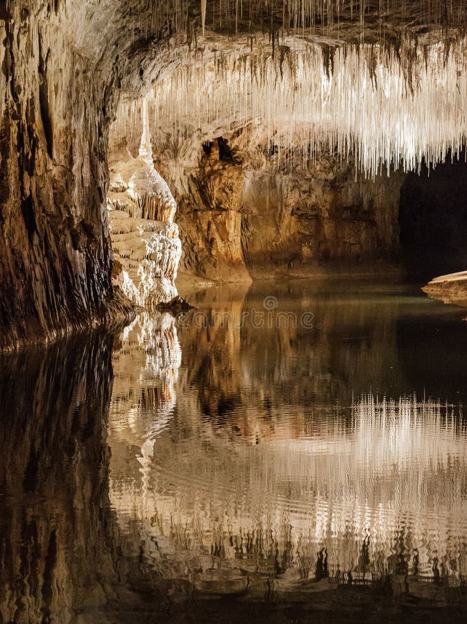 Vertical Shot of the Inside of a Cave with Stalagmites and Stalactites ...