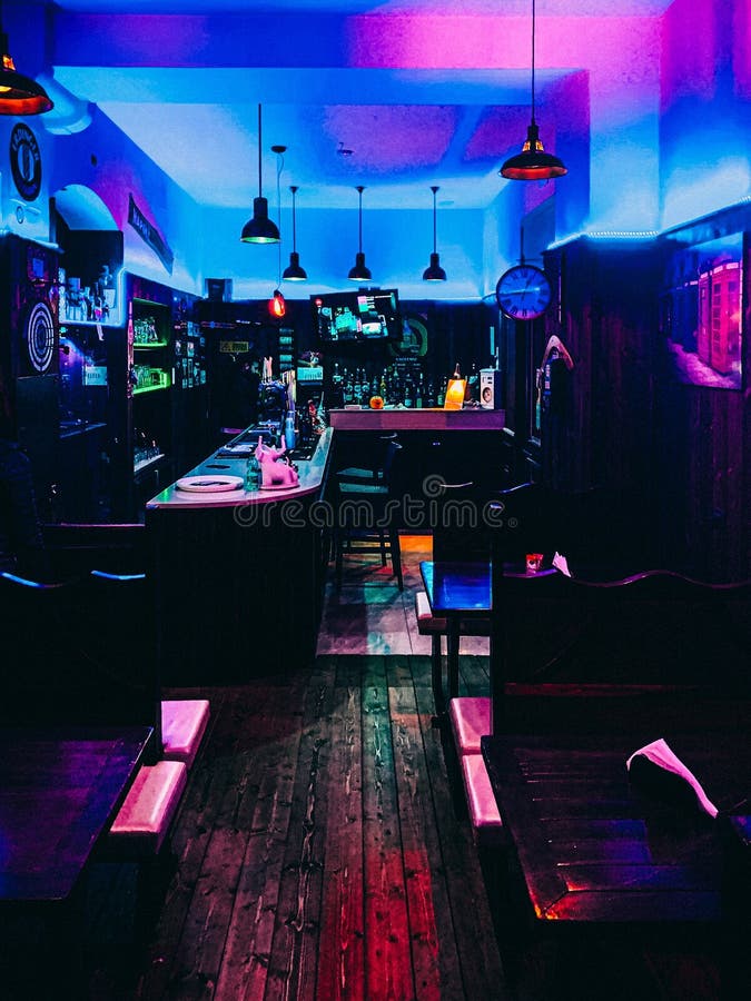 Vertical Shot of an Interior of a Pub with Blue and Purple Lights Stock ...
