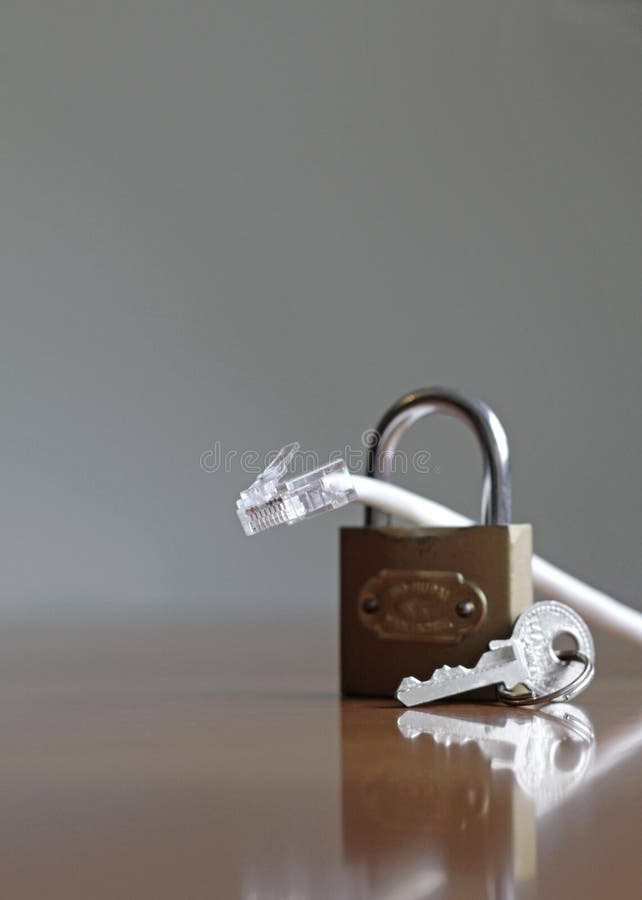 Vertical Shot of an Internet Cable through a Lock Near a Key Stock ...