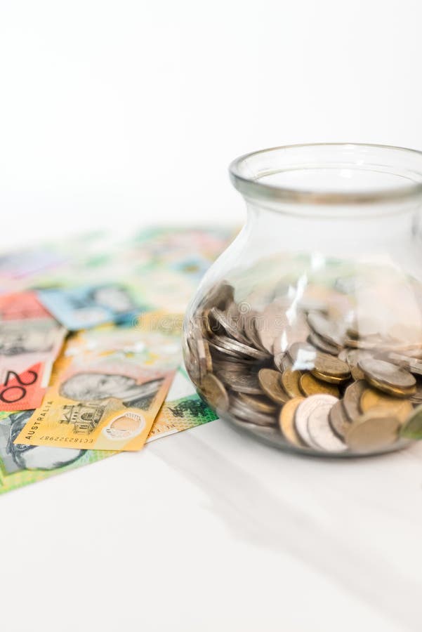 Vertical Shot of a Jar with Coins and Australian Dollar Banknotes on ...
