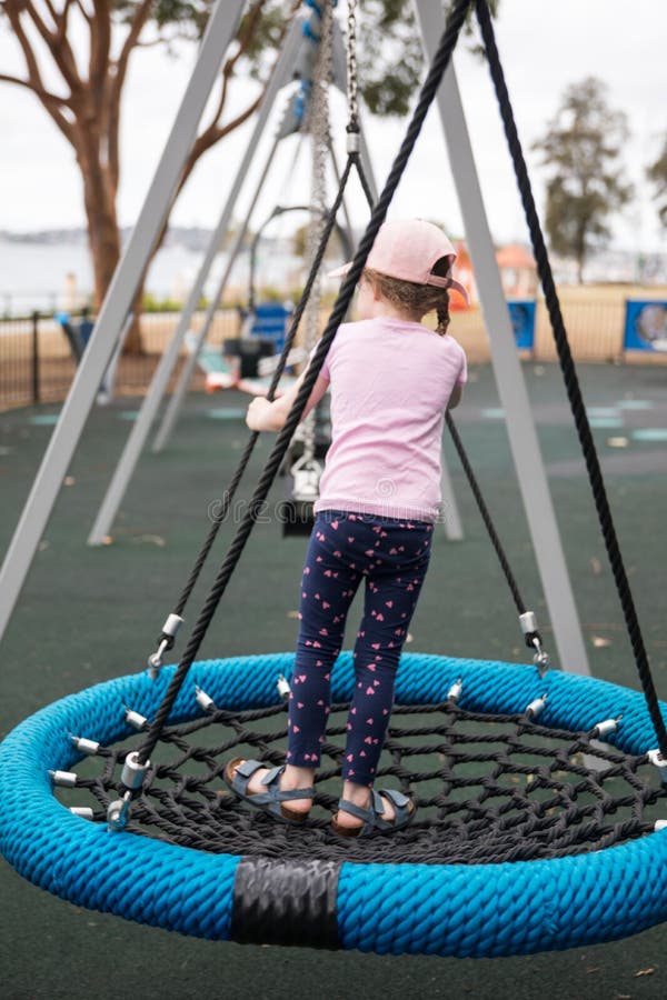 Vertical Shot of a Kid Playing on the Playground Stock Image - Image of ...