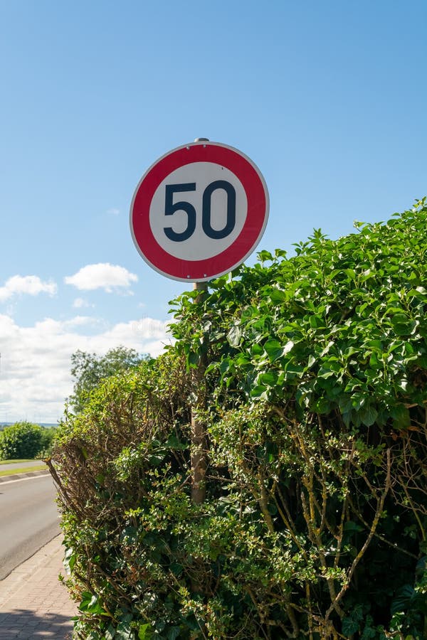 Vertical Shot of 50 Km/h Speed Limit Sign Under Blue Sky Stock Image ...