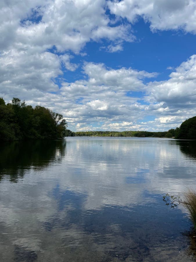 Vertical Shot of a Lake and Sky Reflection in the Lake Stock Photo ...