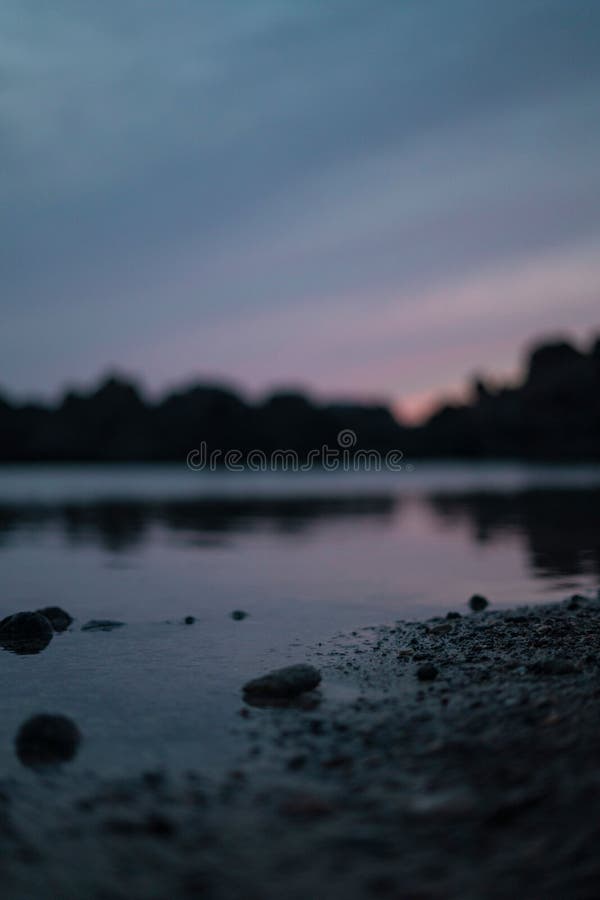Vertical Shot of a Lake at Sunset Stock Image - Image of vertical, aqua ...