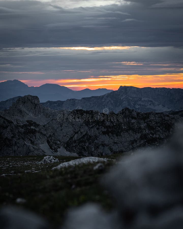 Vertical Shot of a Landscape Under the Clouds during the Sunset Stock ...