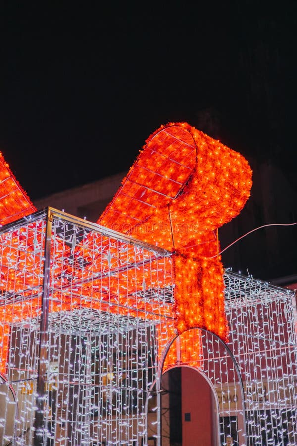 Vertical Shot of the Large Gift Box Structure Covered by Lights for ...