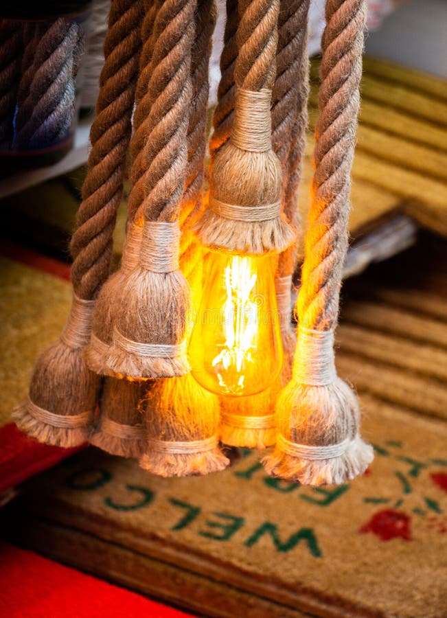 Vertical Shot of Light Bulb Under the Tassel Stock Image - Image of ...
