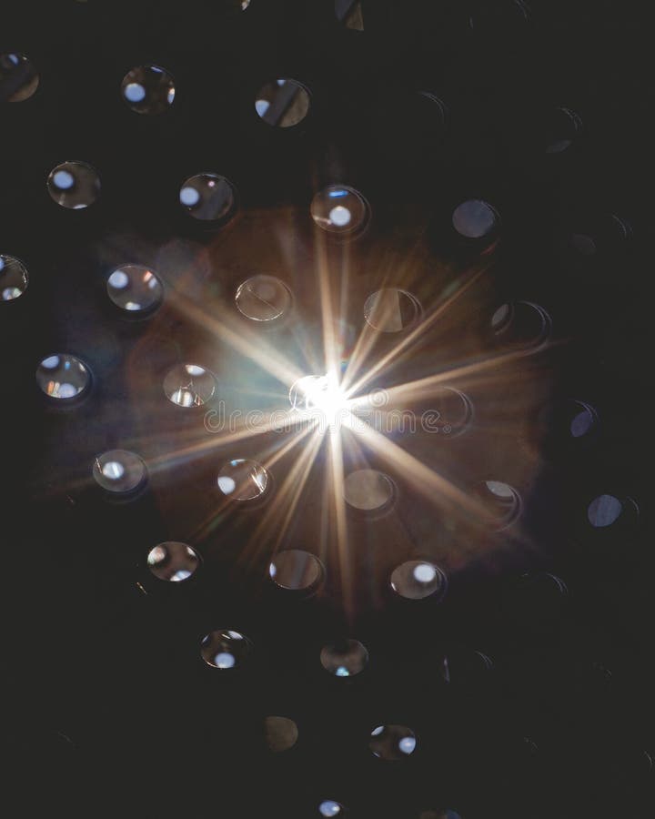 Vertical Shot of the Light Falling through Holes Covered in Spiderweb ...