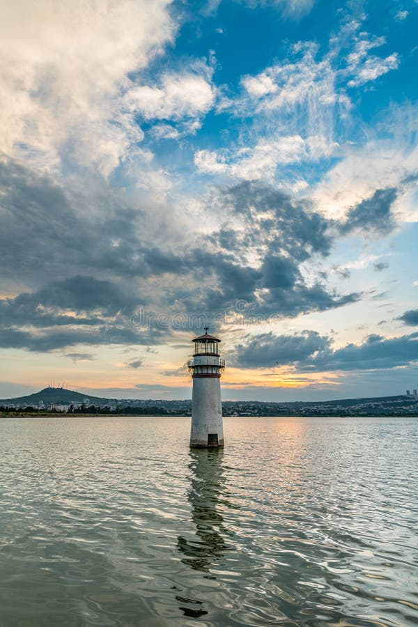 Vertical Shot of a Lighthouse Touching the Sky in the Sea Stock Image ...