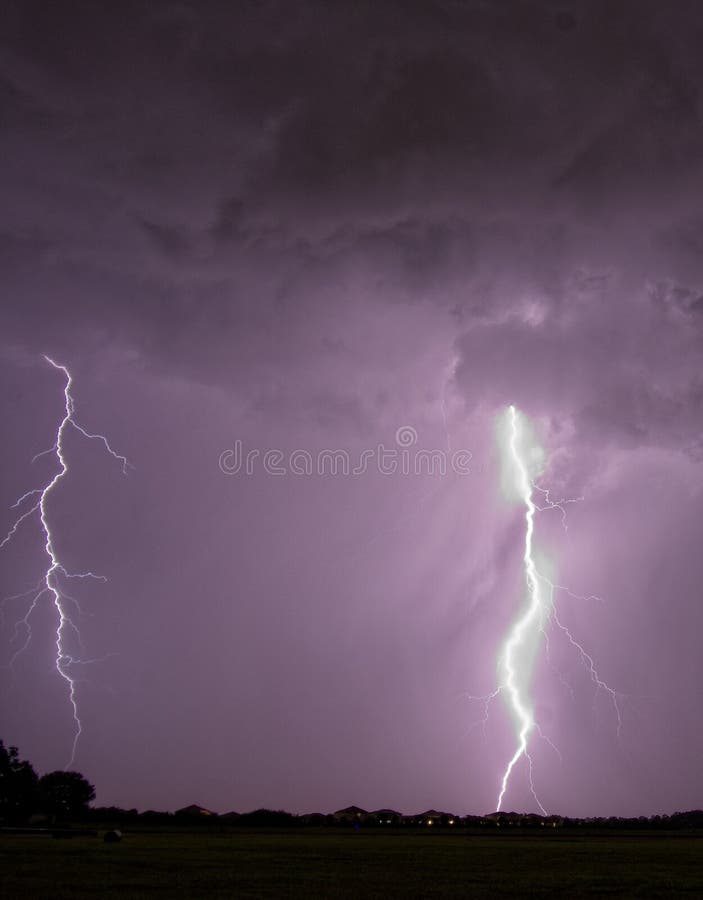 Vertical Shot of the Lightning with a Purple, Cloudy Sky in the ...
