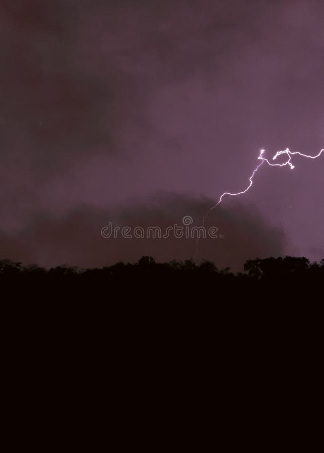 Vertical Shot of the Lightning in the Purple Sky Stock Photo - Image of ...