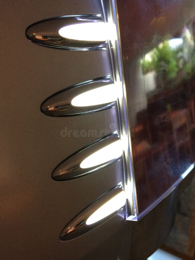 Vertical Shot of Lights Attached To a Metal Surface Stock Image - Image ...