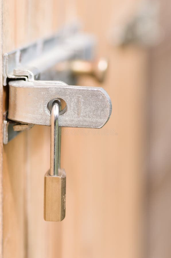 Vertical Shot of a Lock on a Wooden Door Stock Photo - Image of wood ...