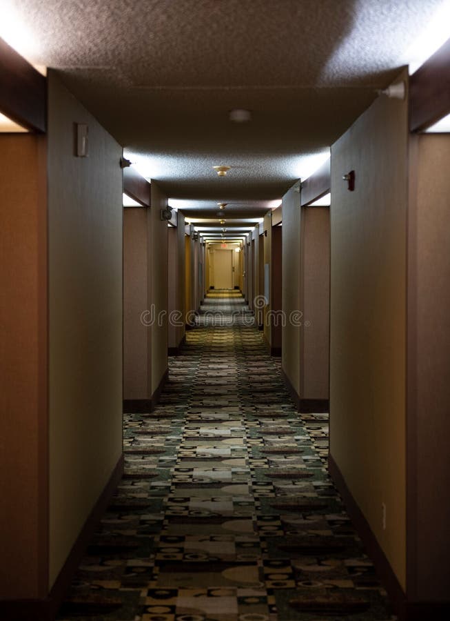 Vertical Shot of the Long Corridor Inside a Modern Hotel Stock Image ...