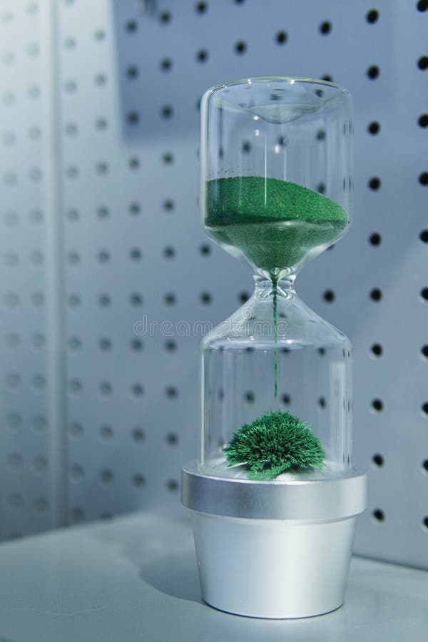 Vertical Shot of a Magnetic Green Sand Hourglass Stock Photo - Image of ...