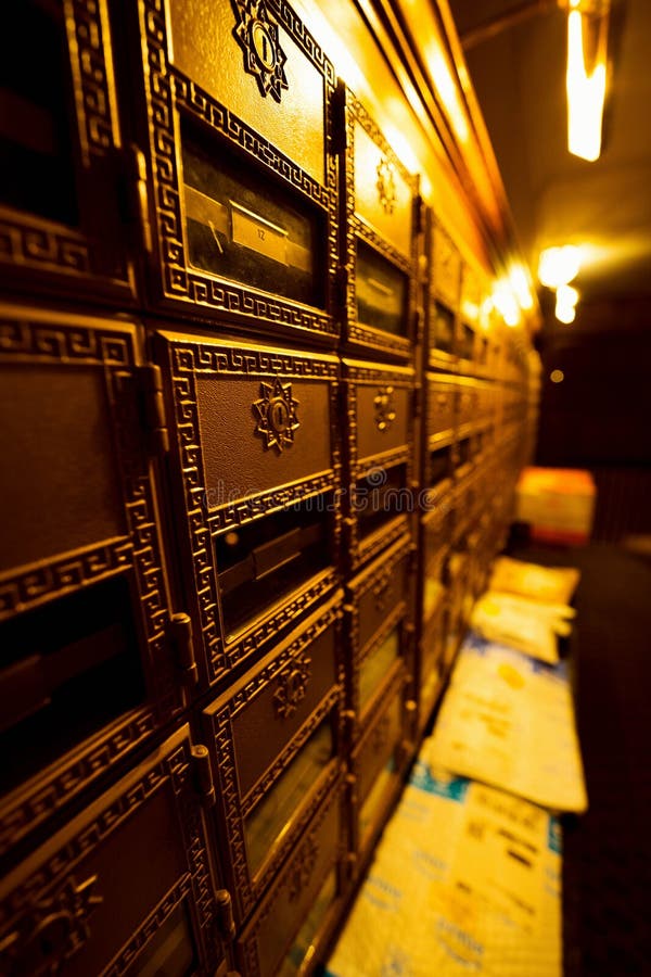 Vertical Shot of Mailboxes in a Building on Blurred Background Stock ...