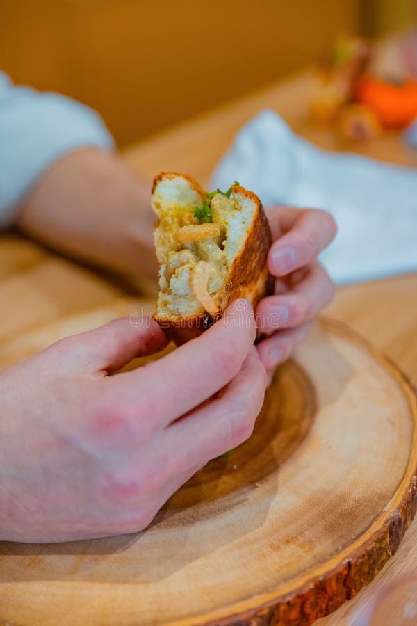 Vertical Shot of a Male Eating a Vegan Burger Stock Image - Image of ...