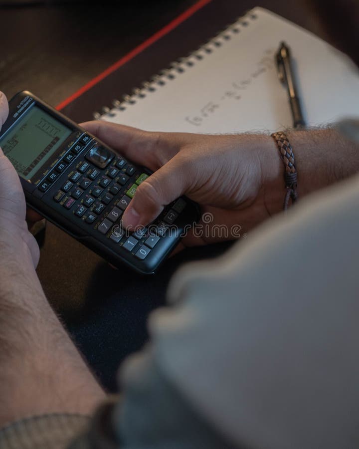Vertical Shot of a Male S Hands Using a Graphing Calculator Stock Photo ...