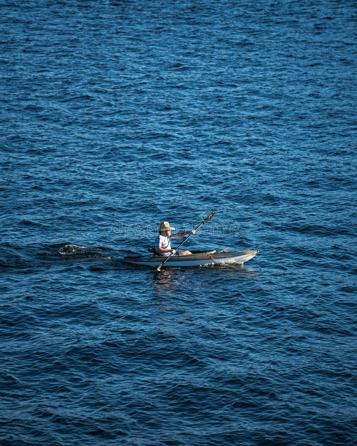 Vertical Shot of a Man Kayaking on Blue Ocean Water Waves in Seattle ...