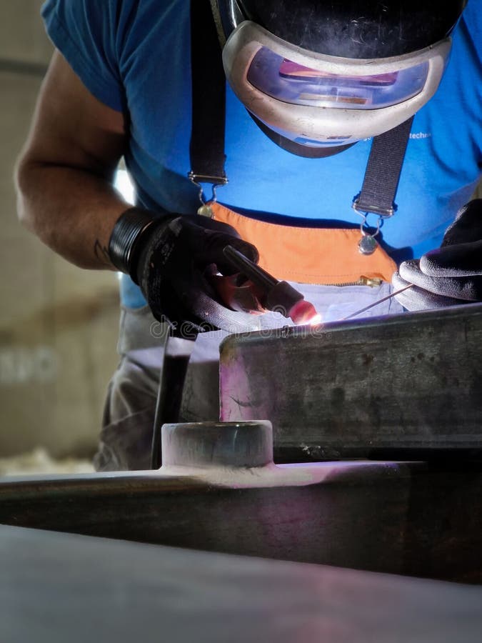 Vertical Shot of a Man during the Welding Process in His Workshop Stock ...