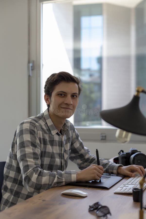 Vertical Shot of a Man Working on a Computer Stock Photo - Image of ...