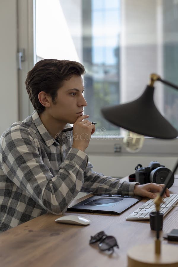 Vertical Shot of a Man Working on a Computer Stock Photo - Image of ...