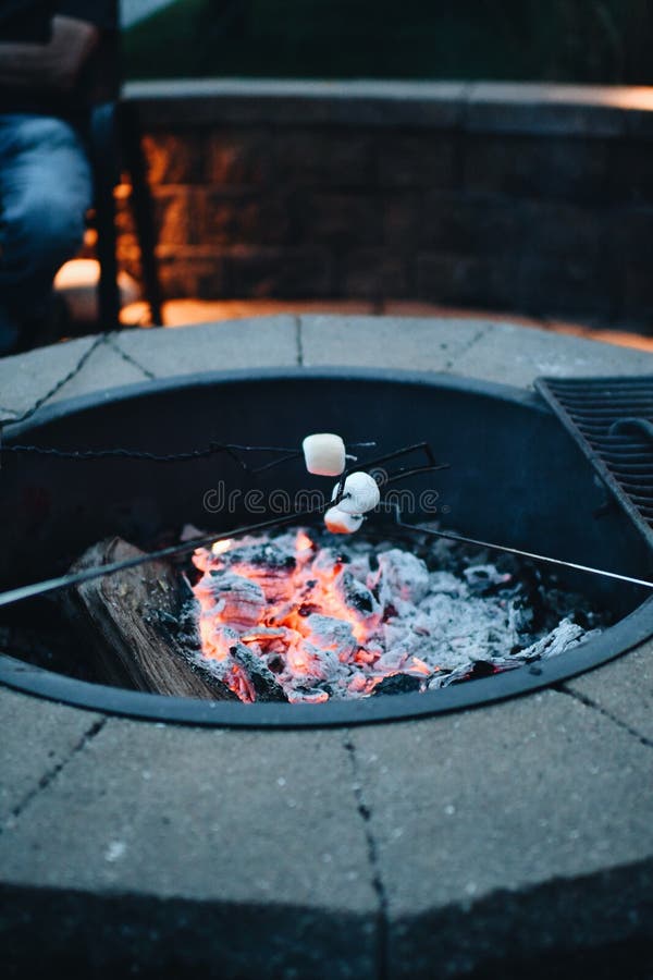 Vertical Shot of Marshmallows Being Roasted Over a Fire Stock Image ...
