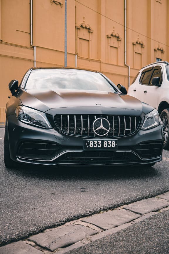 Vertical Shot Of A Matte Black Mercedes Amg C Class Coupe Editorial Photography Image Of Logo