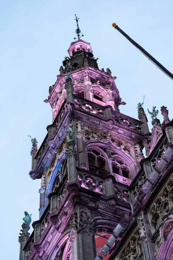 Vertical Shot of a Medieval Tower Building Illuminated with Pink Lights ...