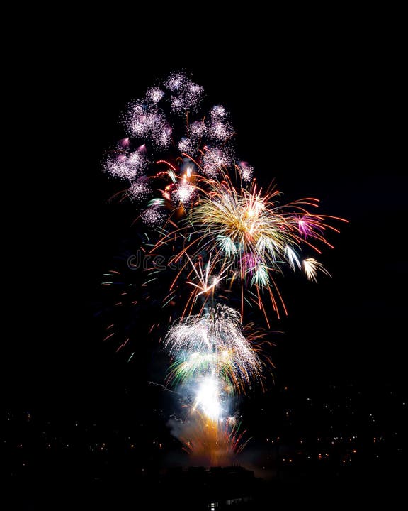 Vertical Shot of the Mesmerizing Exploding Fireworks in the Night Sky ...