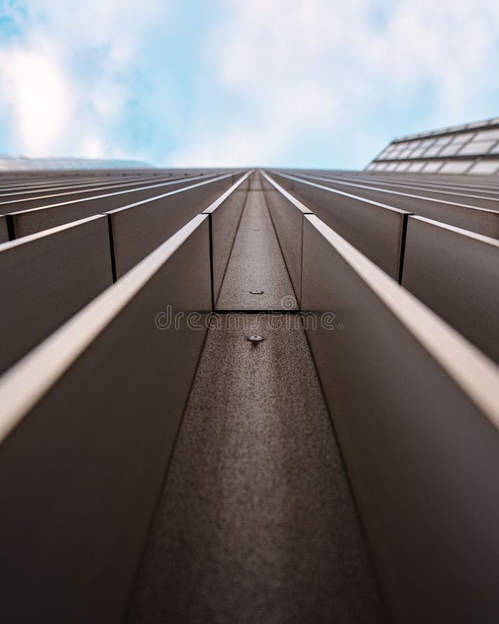 Vertical Shot of a Metal Facade Structure with Parallel Rising Lines ...