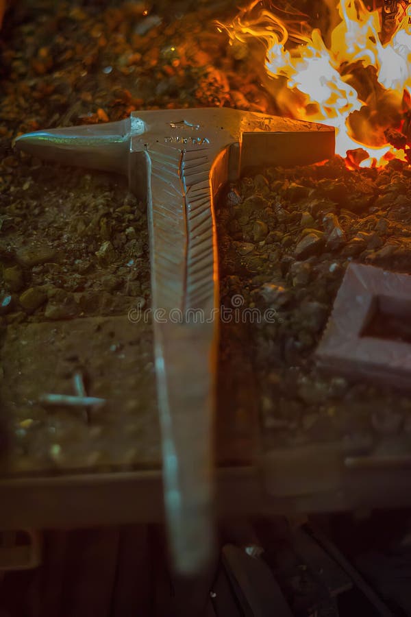 Vertical Shot of a Metal Hammer Near a Fire Stock Image - Image of ...