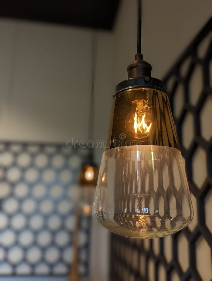Vertical Shot of the Mini Modern Hanging Torch with an Abstract Pattern ...