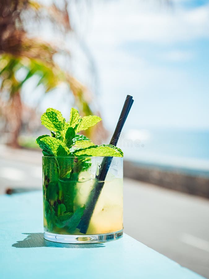 Vertical Shot of a Minty Cocktail on a Table, a Bar Near the Beach ...