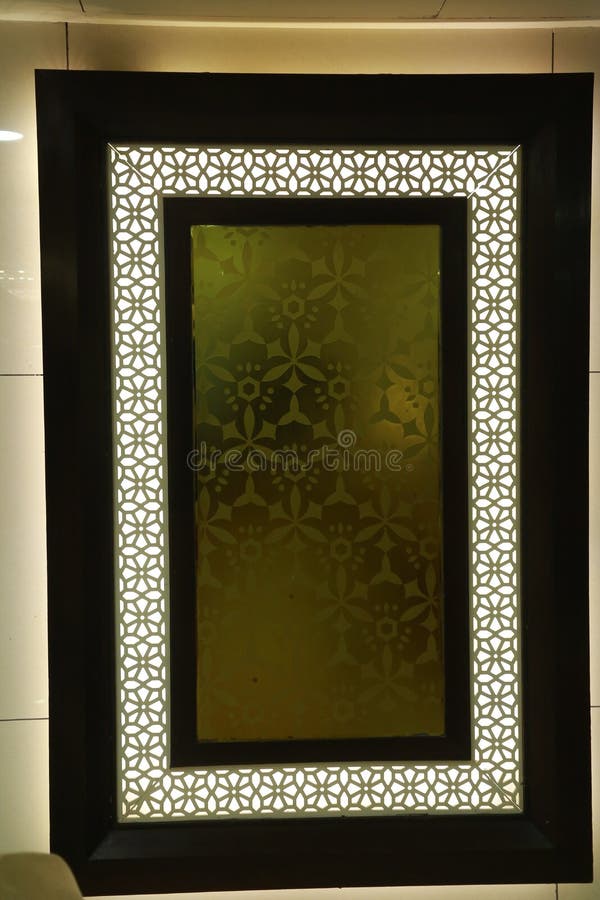 Vertical Shot of a Mirror Frame with Flower-shaped Patterns and Black ...